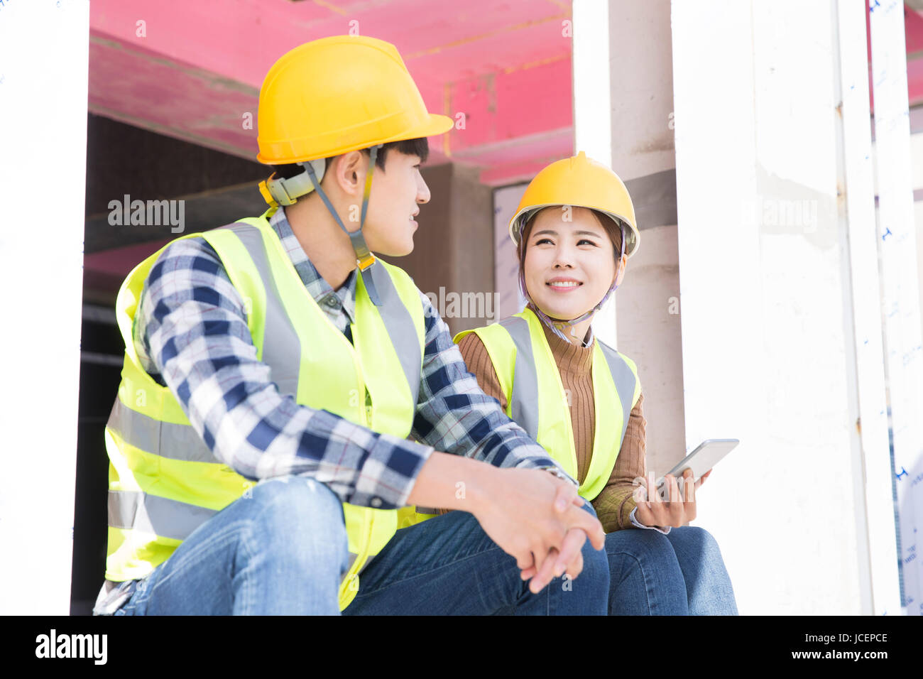 Smiling construction workers Stock Photo - Alamy