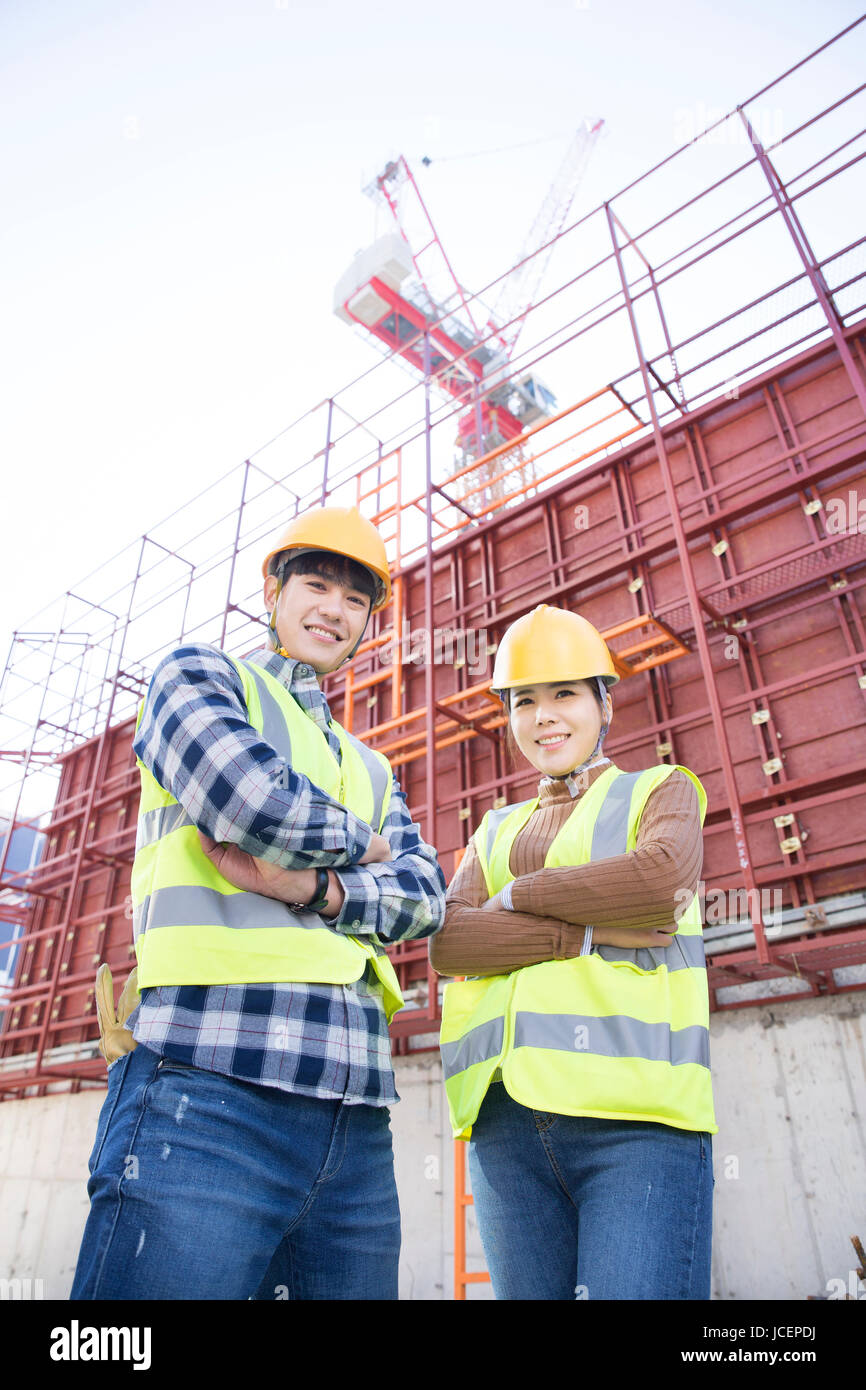 Smiling construction workers Stock Photo - Alamy