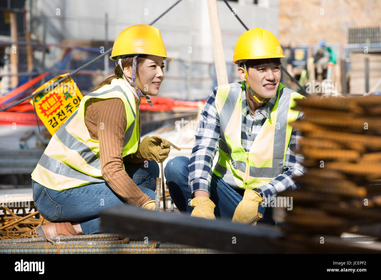 Smiling construction workers Stock Photo - Alamy