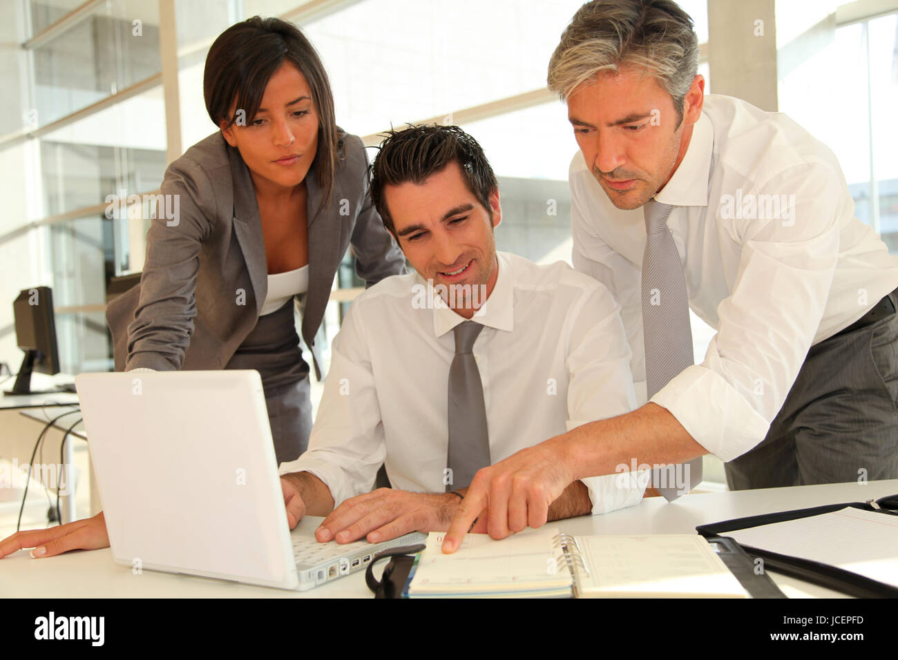 Sales team having business presentation in office Stock Photo - Alamy