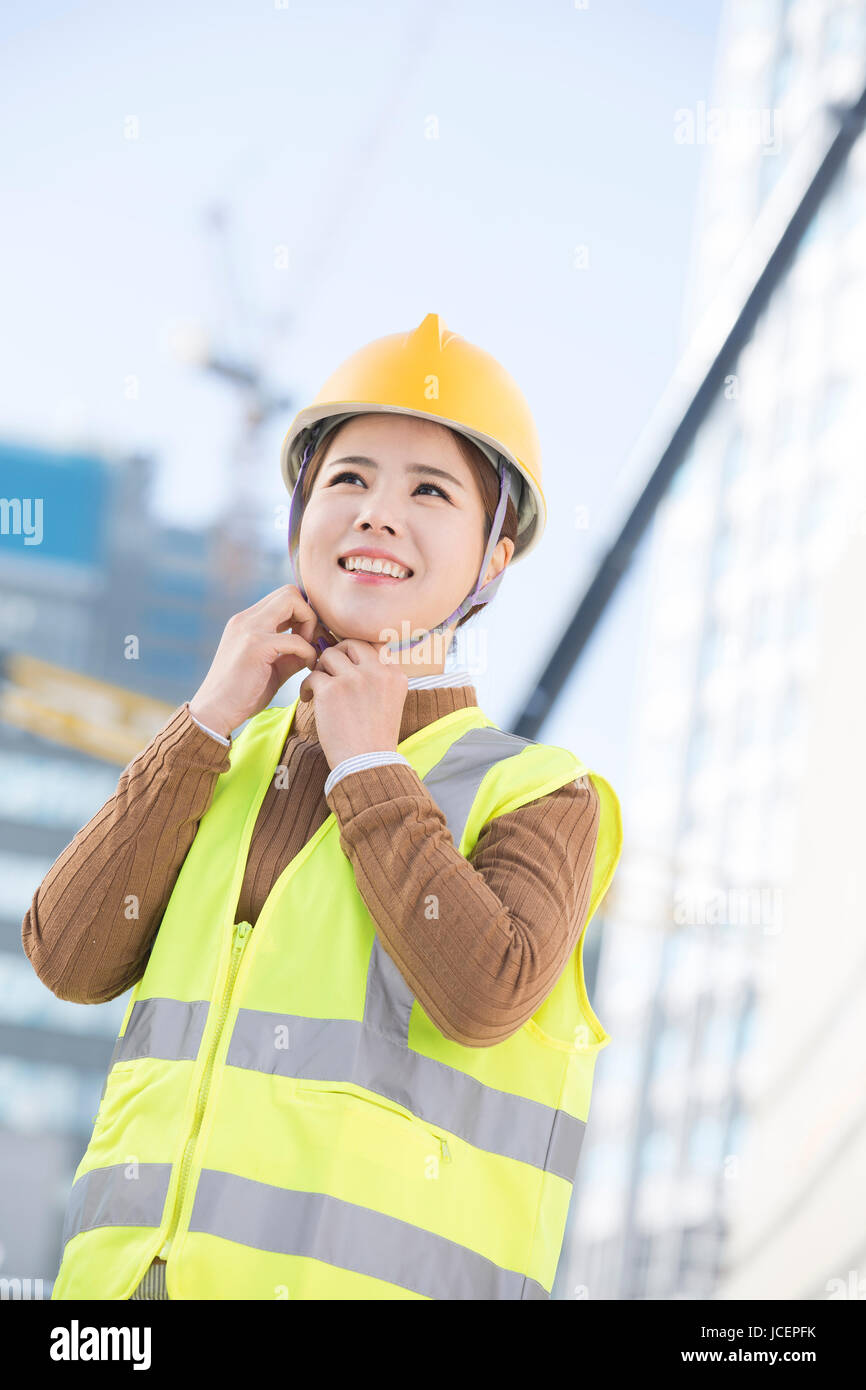 Woman young smile construction hi-res stock photography and images - Alamy