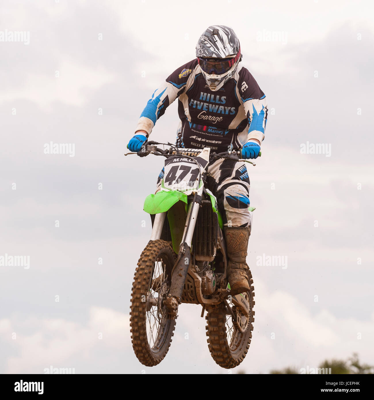 Motocross bike scrambler jumping on a uk track Stock Photo - Alamy