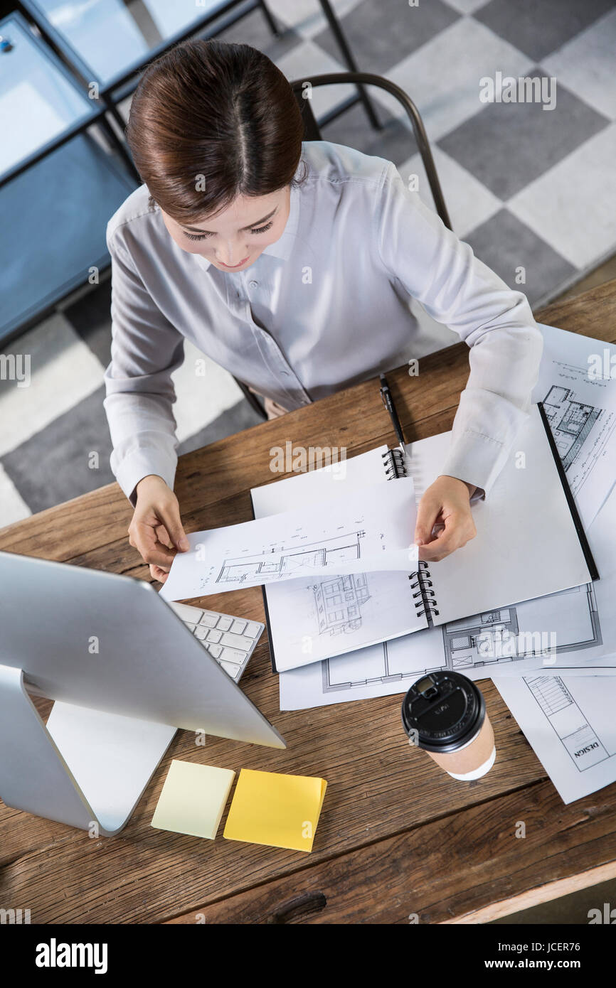 Smiling female architect at office Stock Photo - Alamy