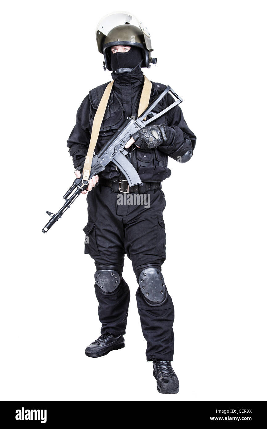 Spec ops soldier in black uniform and face mask with his rifle Stock ...