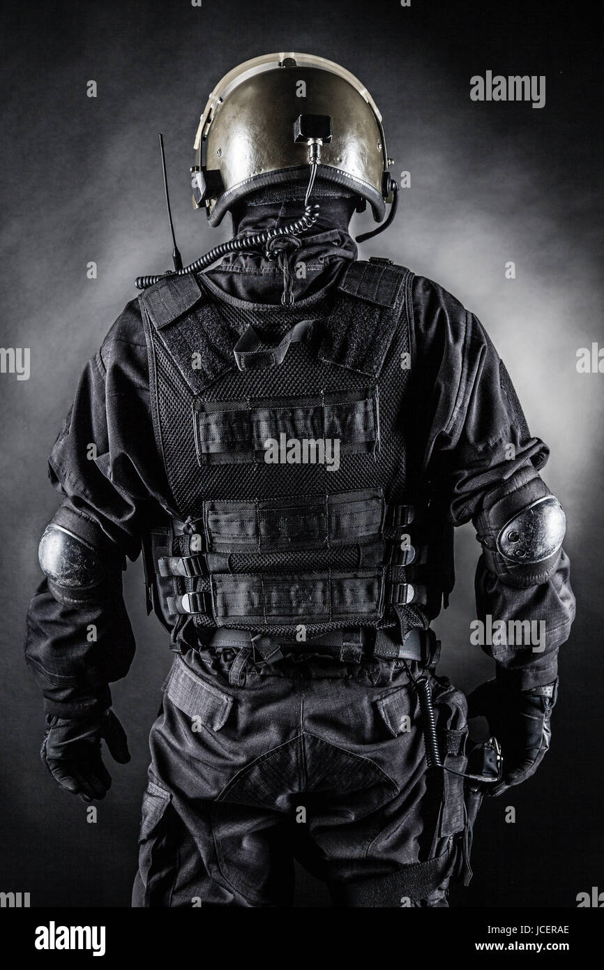 Spec ops soldier on black background shot from behind Stock Photo - Alamy