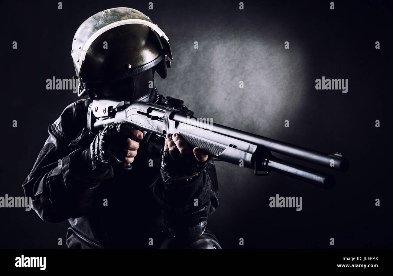 Spec ops soldier on black background with shotgun Stock Photo - Alamy