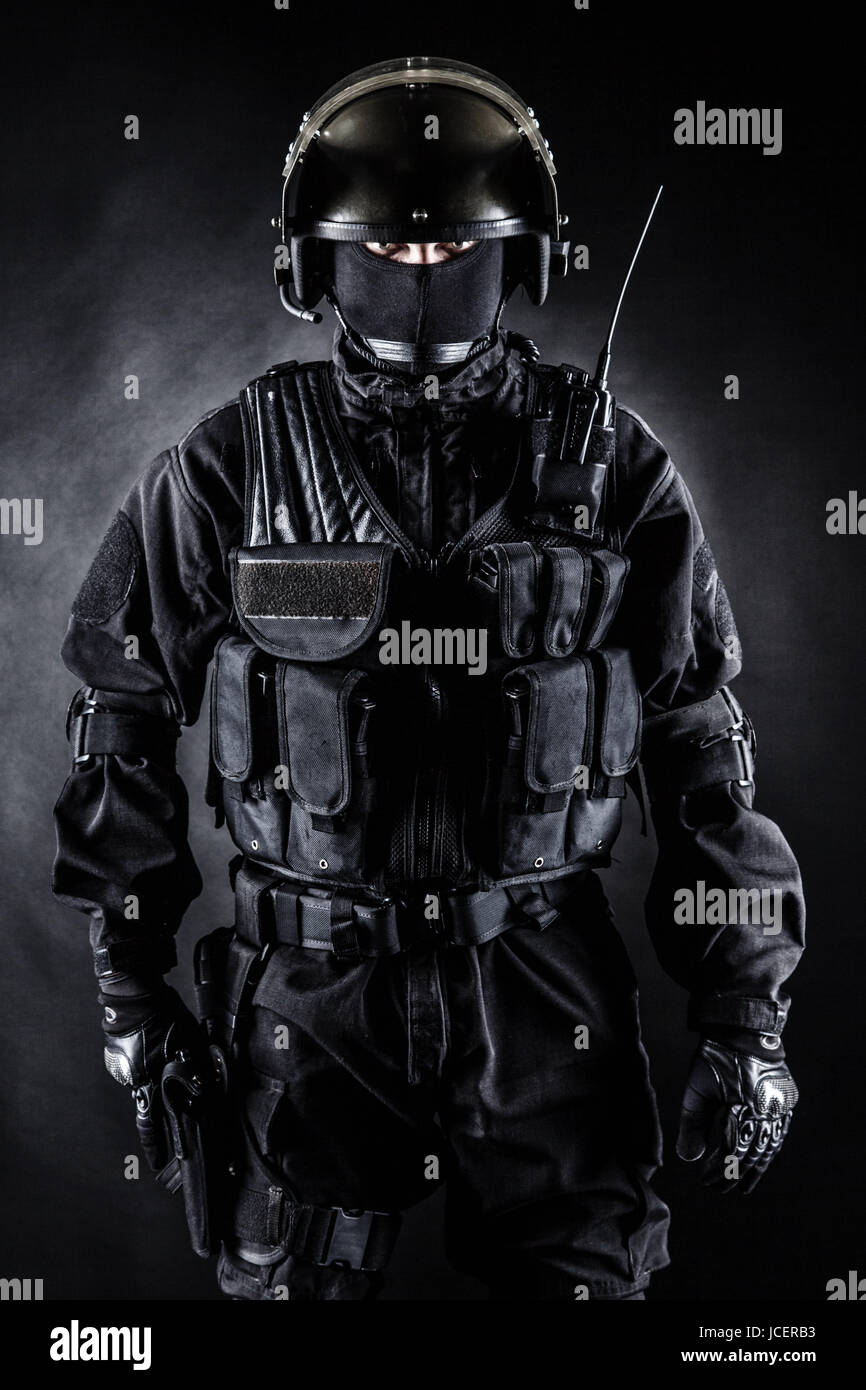 Spec ops soldier in uniform on black background Stock Photo - Alamy