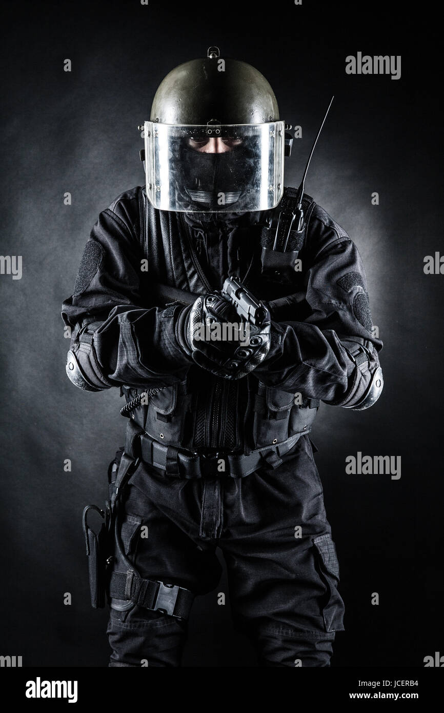 Spec ops soldier in uniform on black background Stock Photo - Alamy