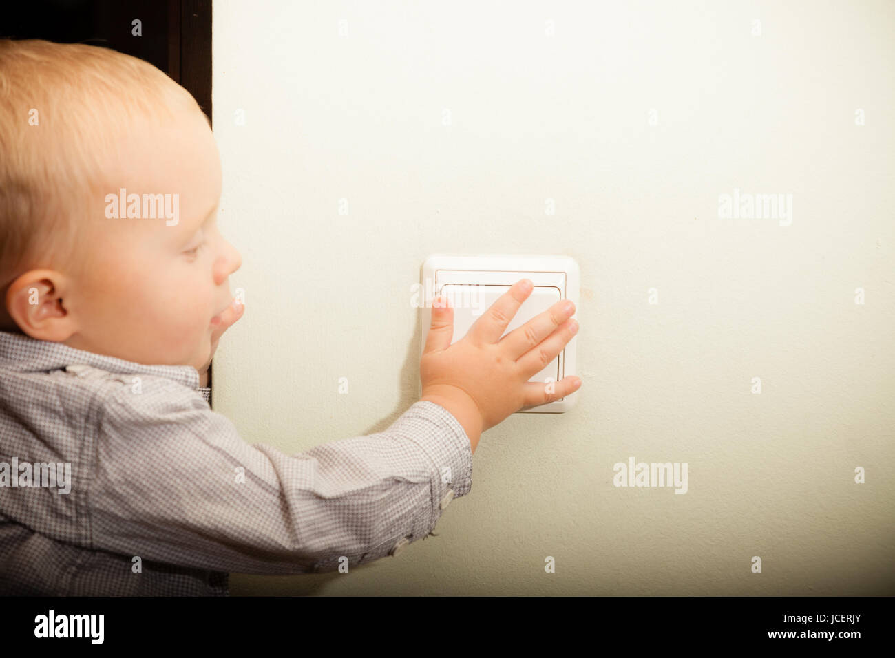 Child turning on light switch High Resolution Stock Photography and ...