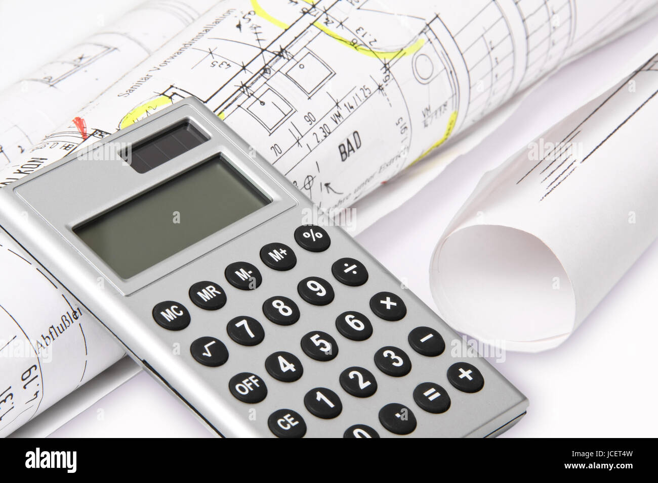 calculator with architect`s plan Stock Photo - Alamy