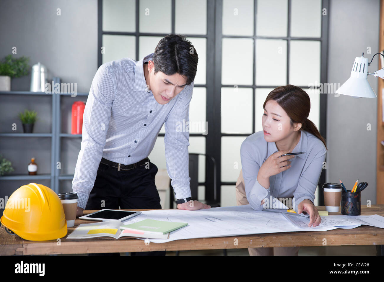 Male architects blueprint working hi-res stock photography and images ...