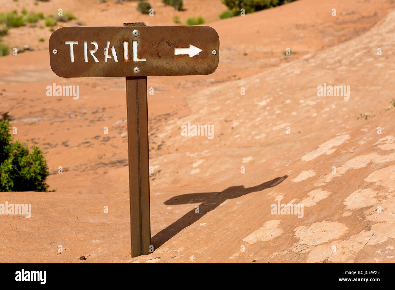 metal trail sign on a rock surface in Arches National Park, Utah Stock ...