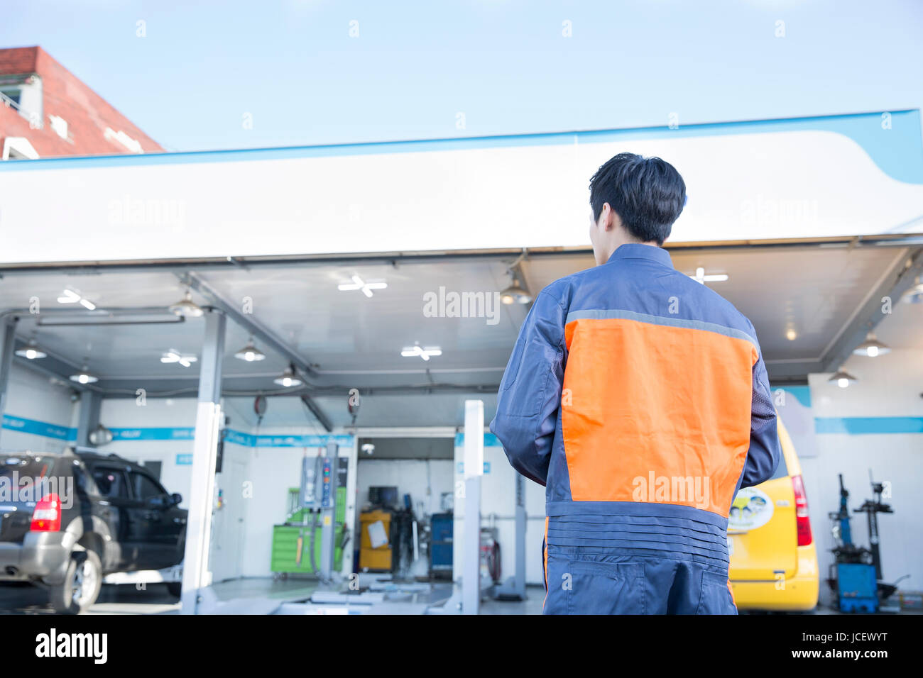 Back of young mechanic Stock Photo - Alamy