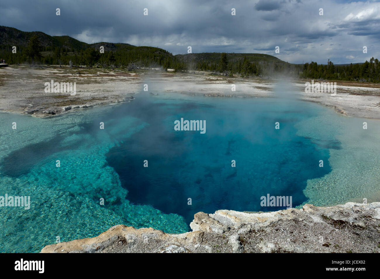 steamy blue post-volcanic pool in Yellowstone National Park Stock Photo ...