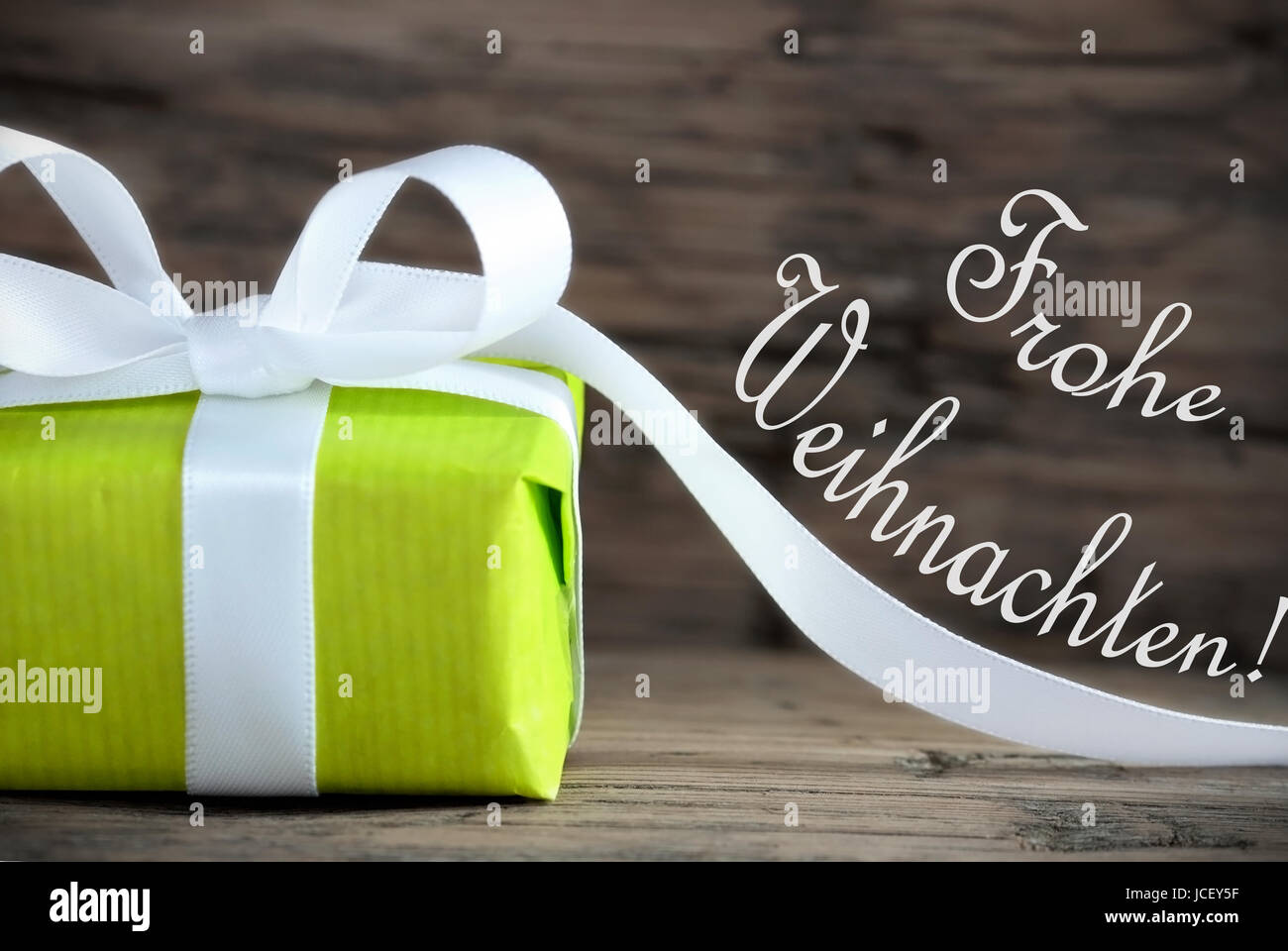 Green Christmas Gift with the German Words Frohe Weihnachten, which ...