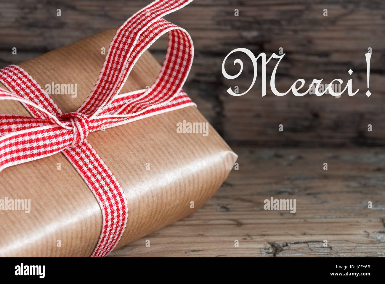 Rustic Gift on Wood with the French Word Merci, which means Thanks ...