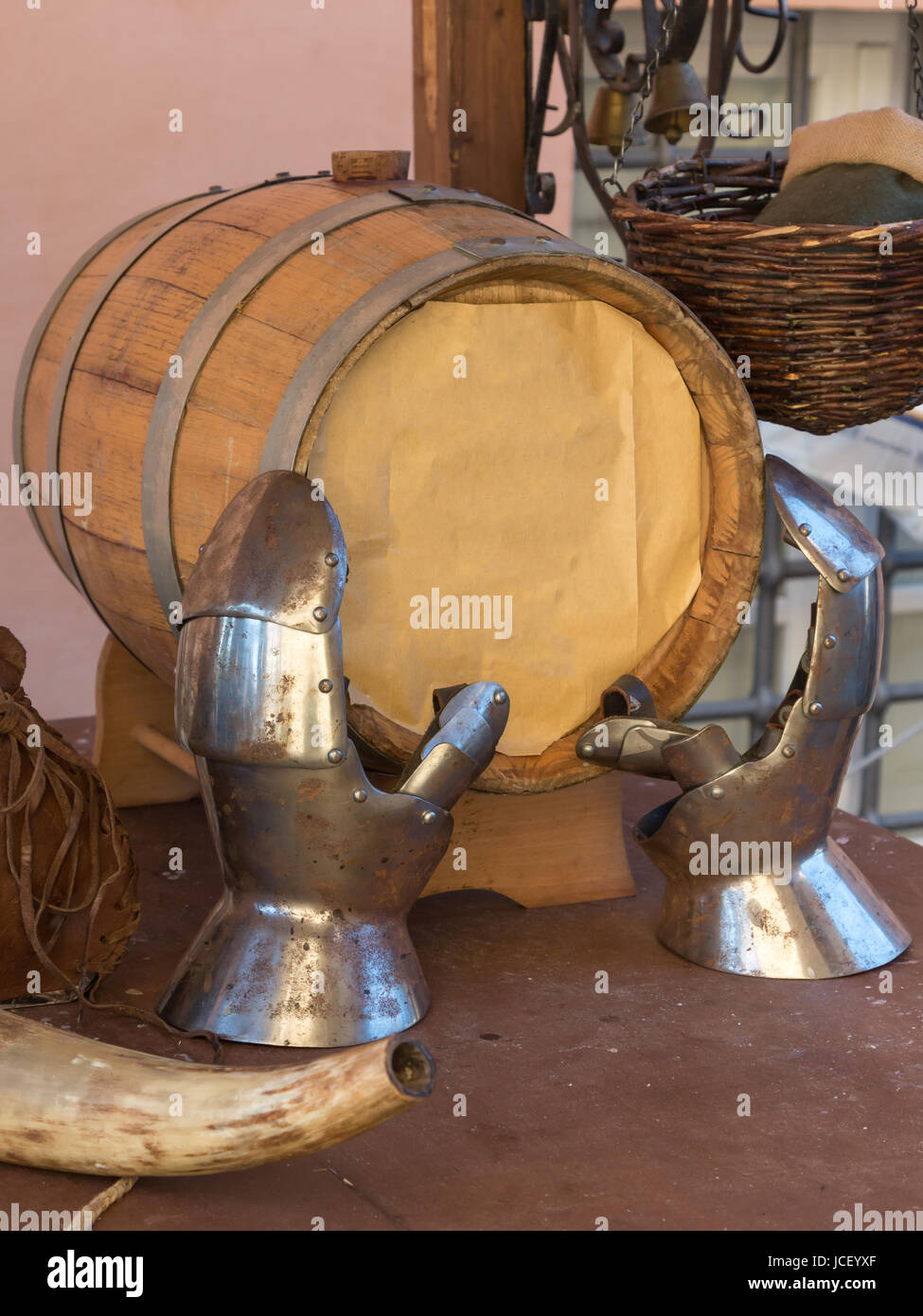 Oak Barrel on Wooden Table with Hand Iron Armors Stock Photo - Alamy