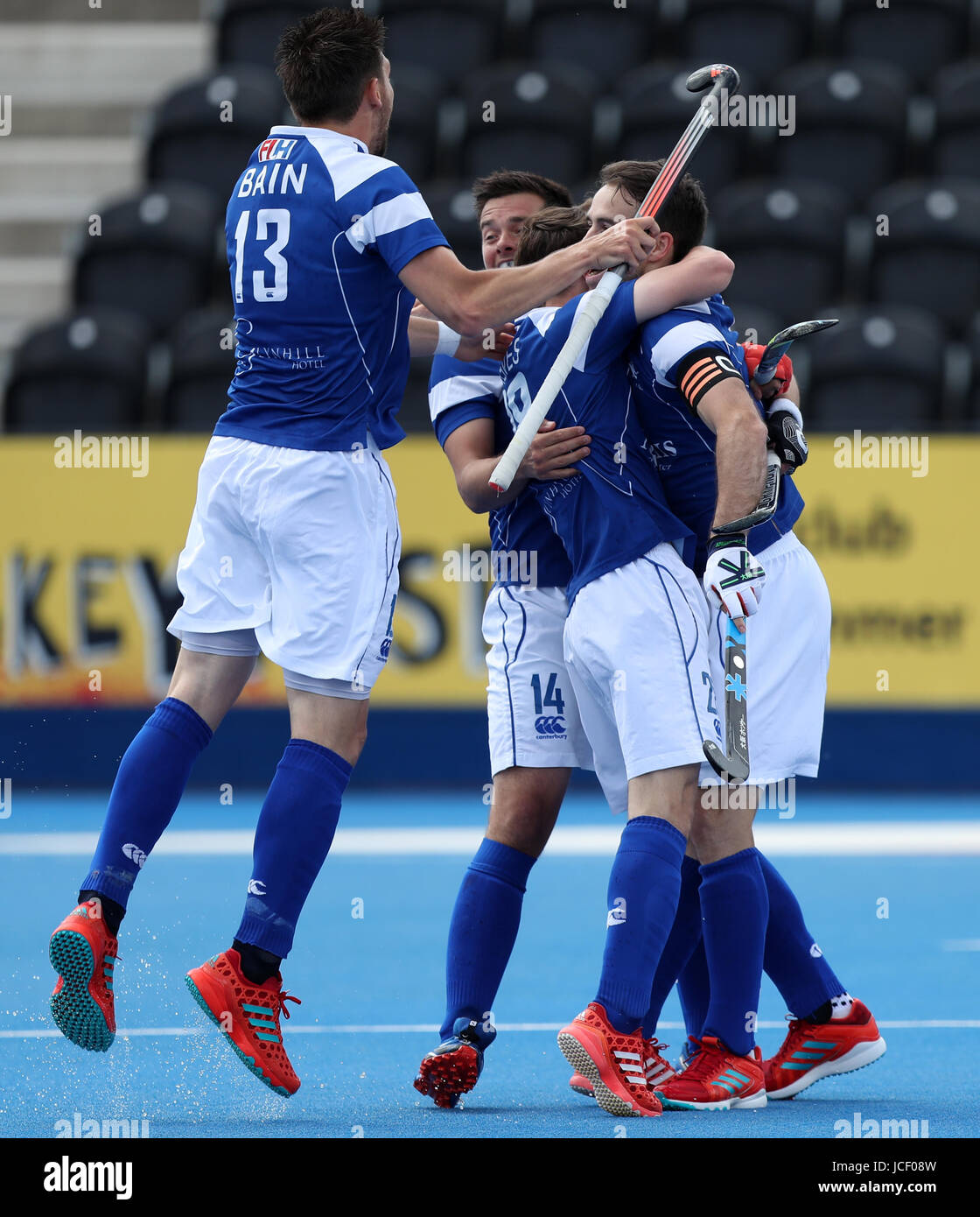 Scotland's Chris Grassick (right) celebrates scoring his side's first ...