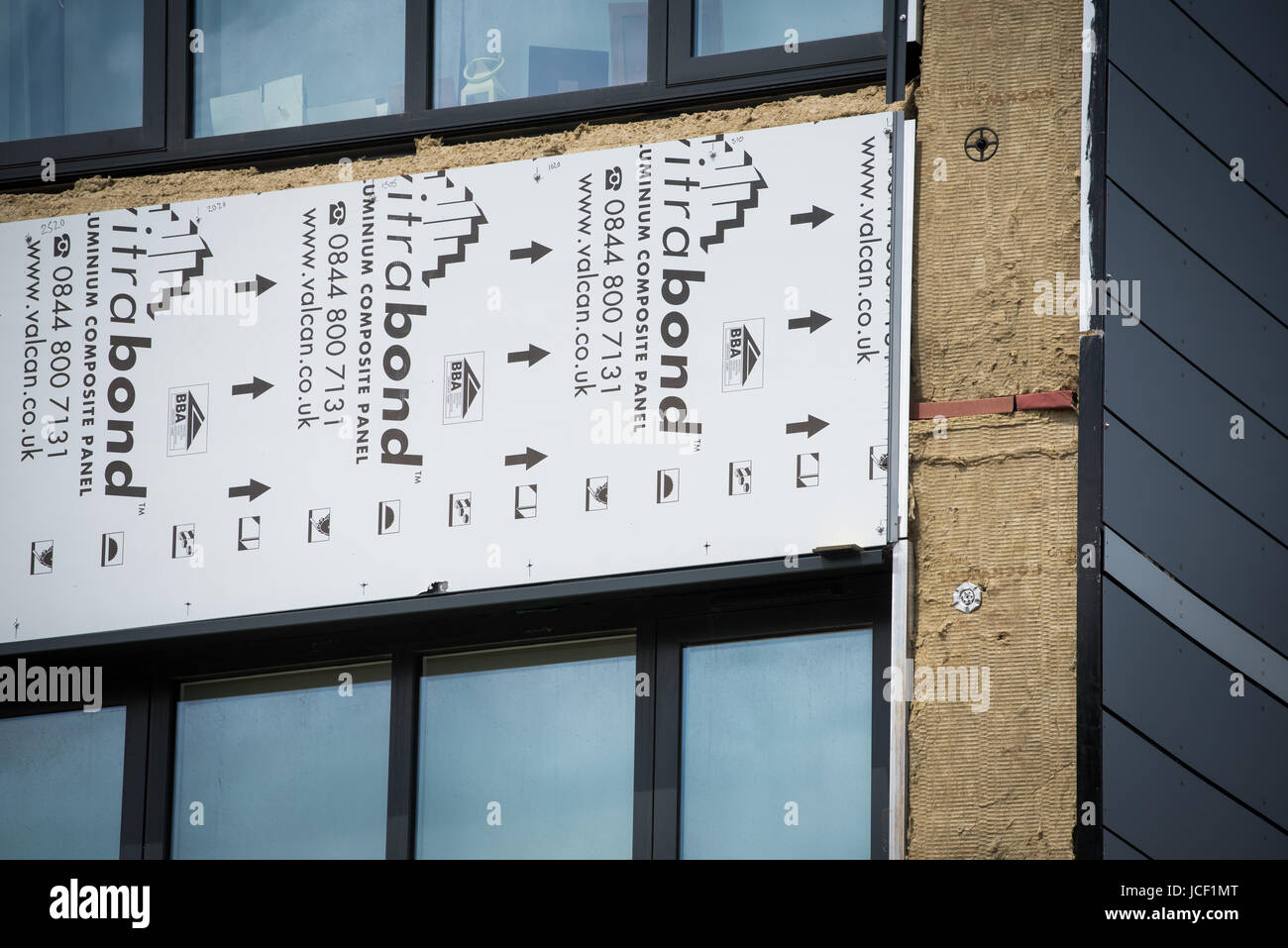 Dangerous flammable cladding panels being removed from on a tower block ...