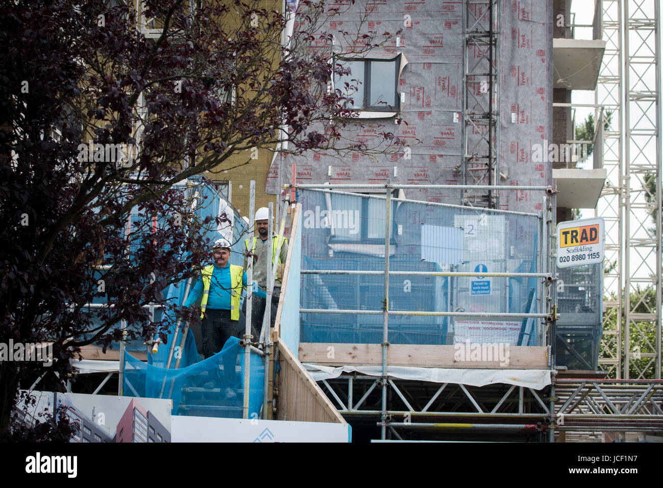 Dangerous flammable cladding panels being removed from on a tower block ...