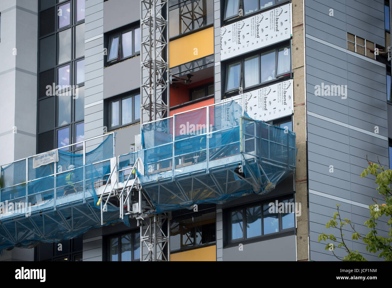 Dangerous flammable cladding panels being removed from on a tower block ...