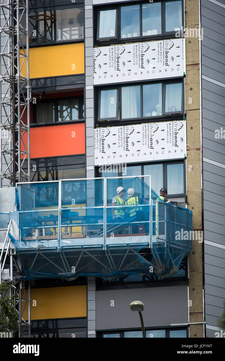 Dangerous flammable cladding panels being removed from on a tower block ...