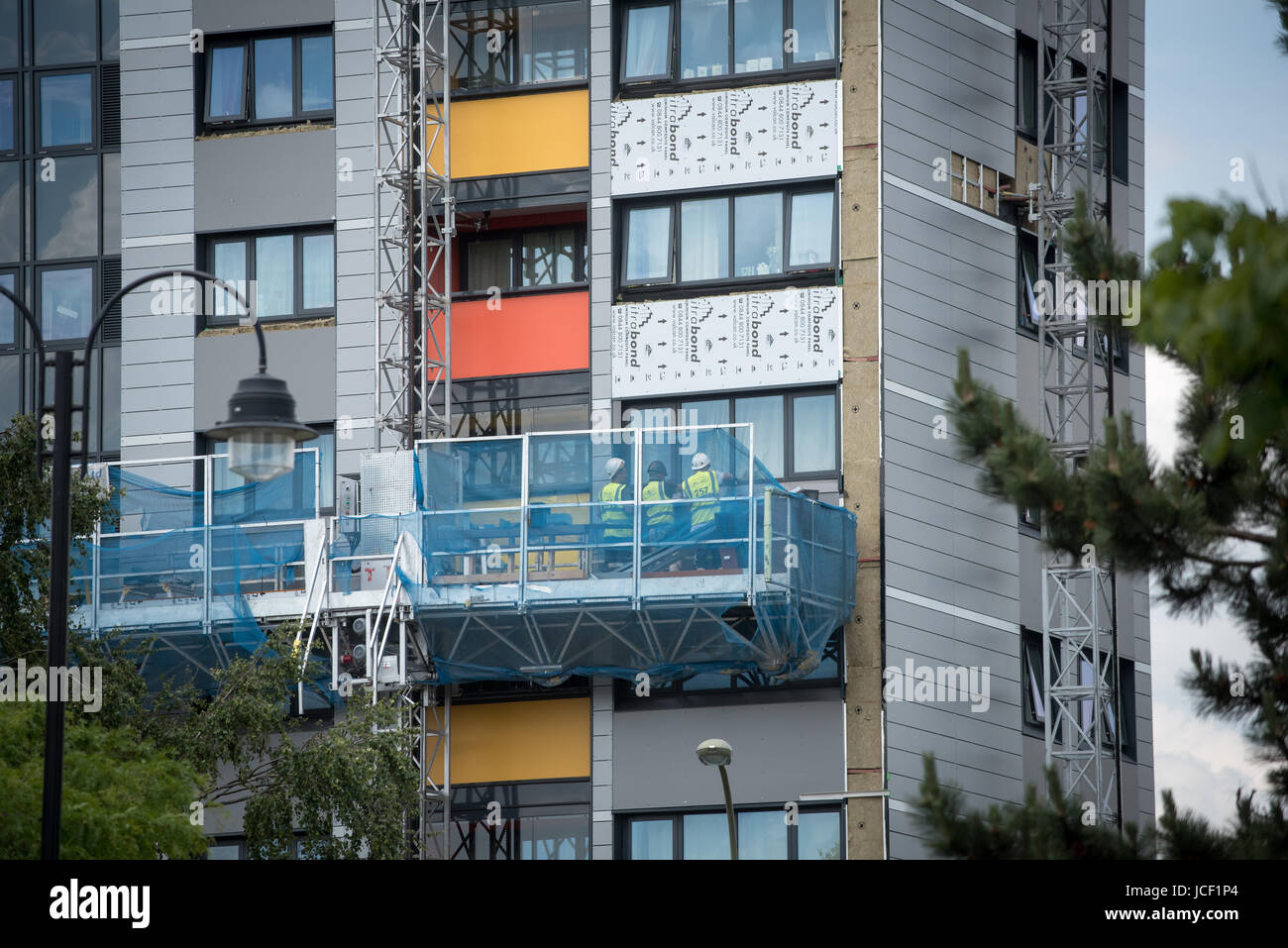 Dangerous flammable cladding panels being removed from on a tower block ...