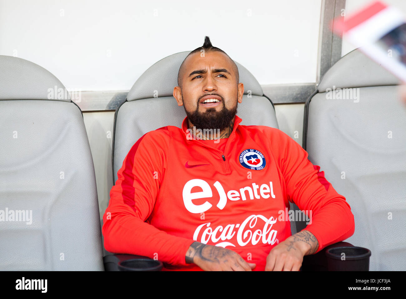 Arturo Vidal (R) of Chile on the bench before Romania vs Chile friendly ...
