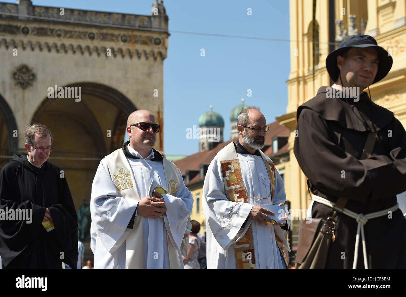 Munich, Germany. 15th June, 2017. Priests and nuns walk past the ...