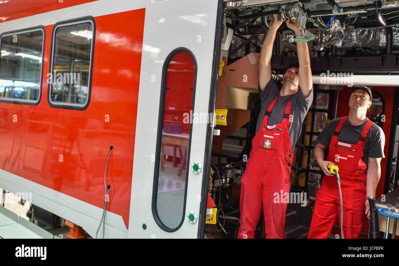 Bautzen, Germany. 15th June, 2017. Employees work on the double decker ...