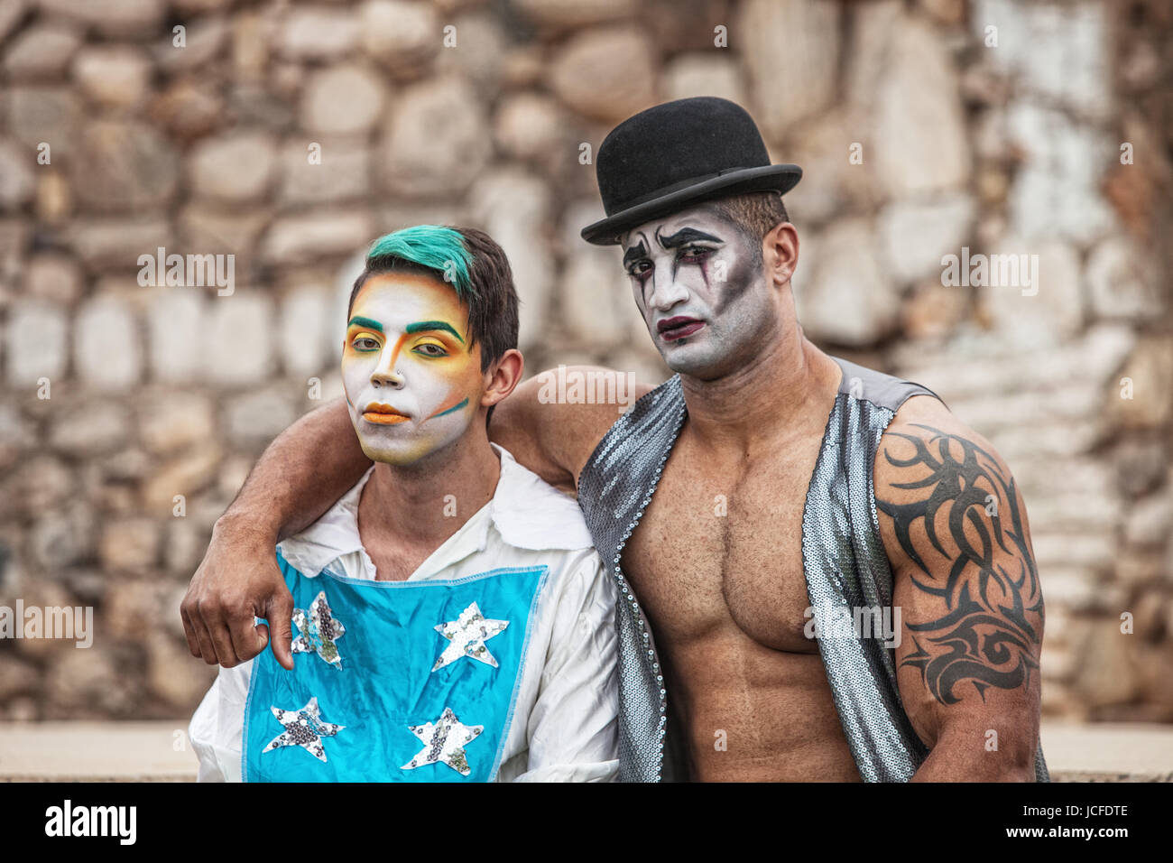 Pair of handsome male cirque performers outside Stock Photo - Alamy