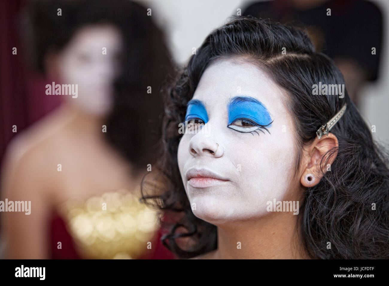 Serious young female cirque performer with white facepaint Stock Photo ...