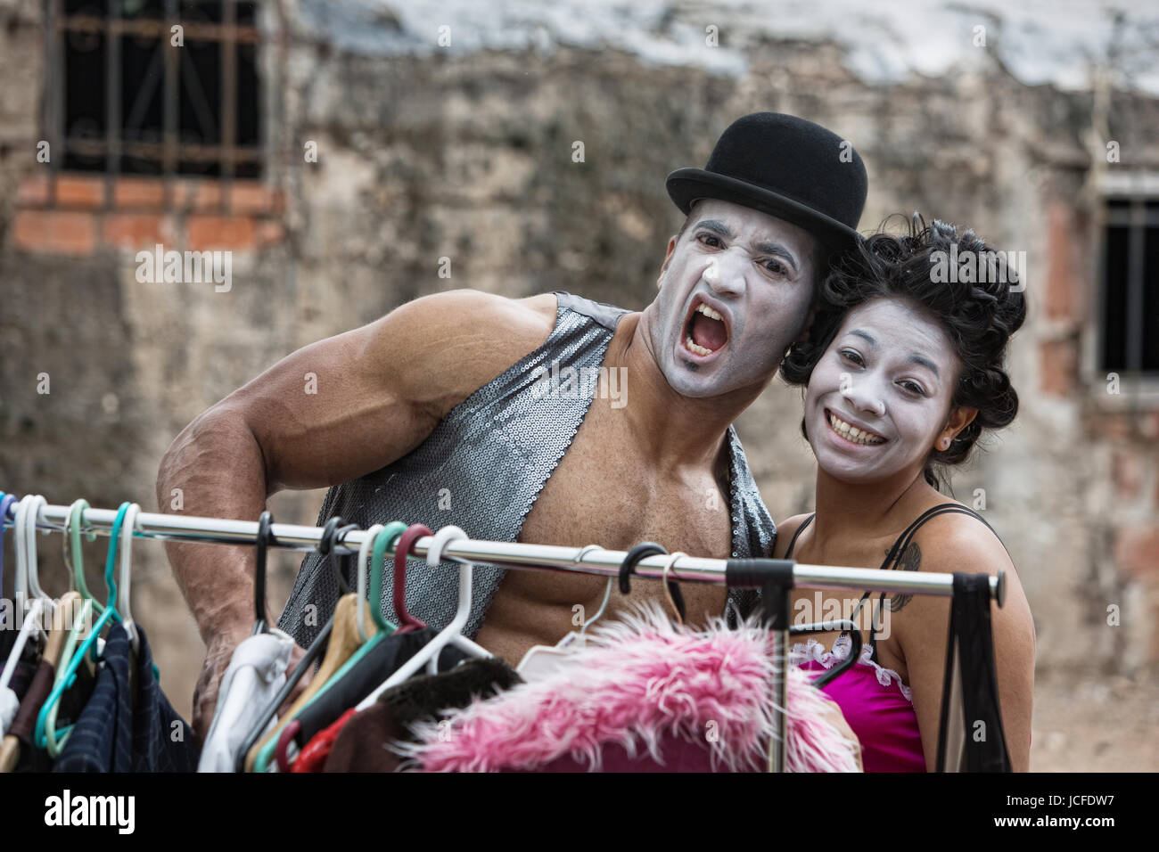 Laughing cirque clowns with makeup at clothing rack Stock Photo - Alamy