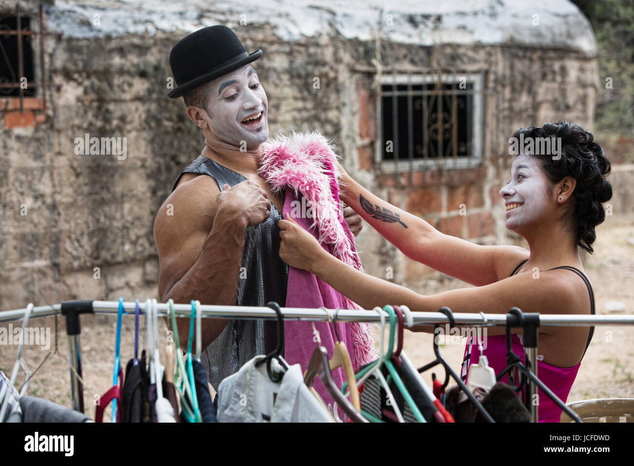 Two laughing cirque clowns fitting costumes outdoors Stock Photo - Alamy