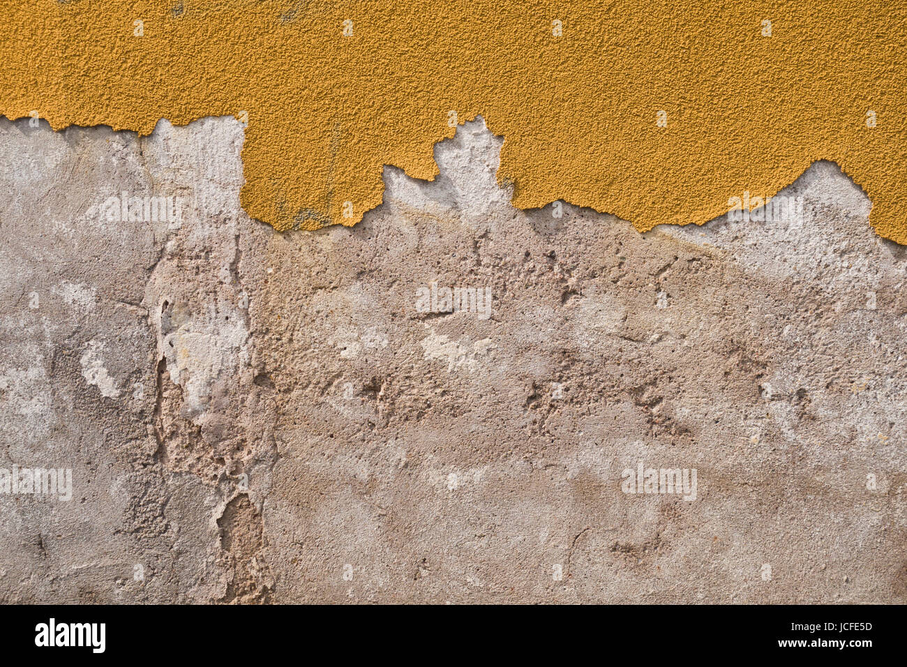yellow wall damaged and in decay Stock Photo - Alamy