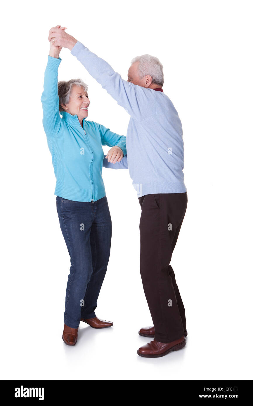 Portrait Of Senior Couple Dancing On White Background Stock Photo - Alamy