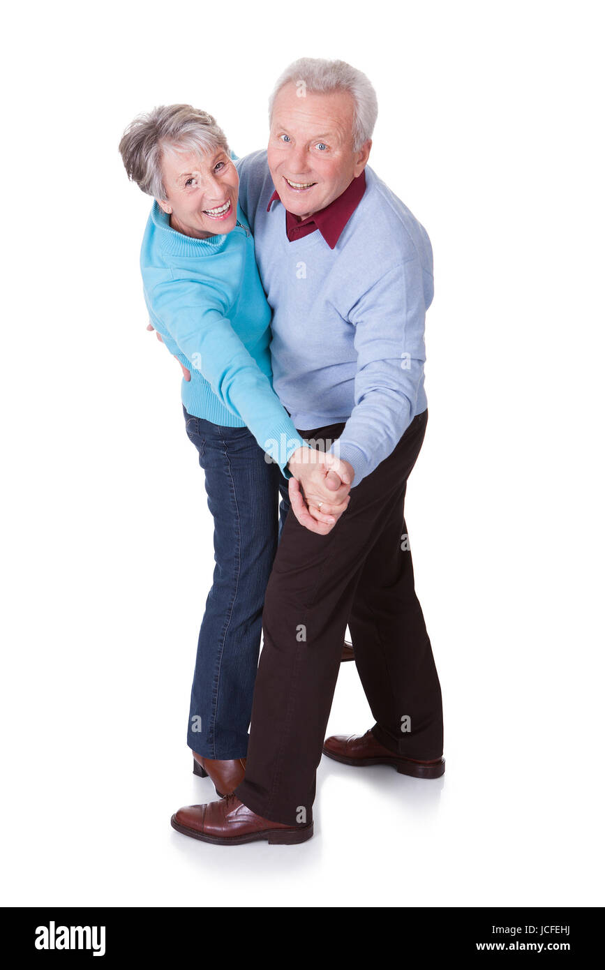 Portrait Of Senior Couple Dancing On White Background Stock Photo - Alamy