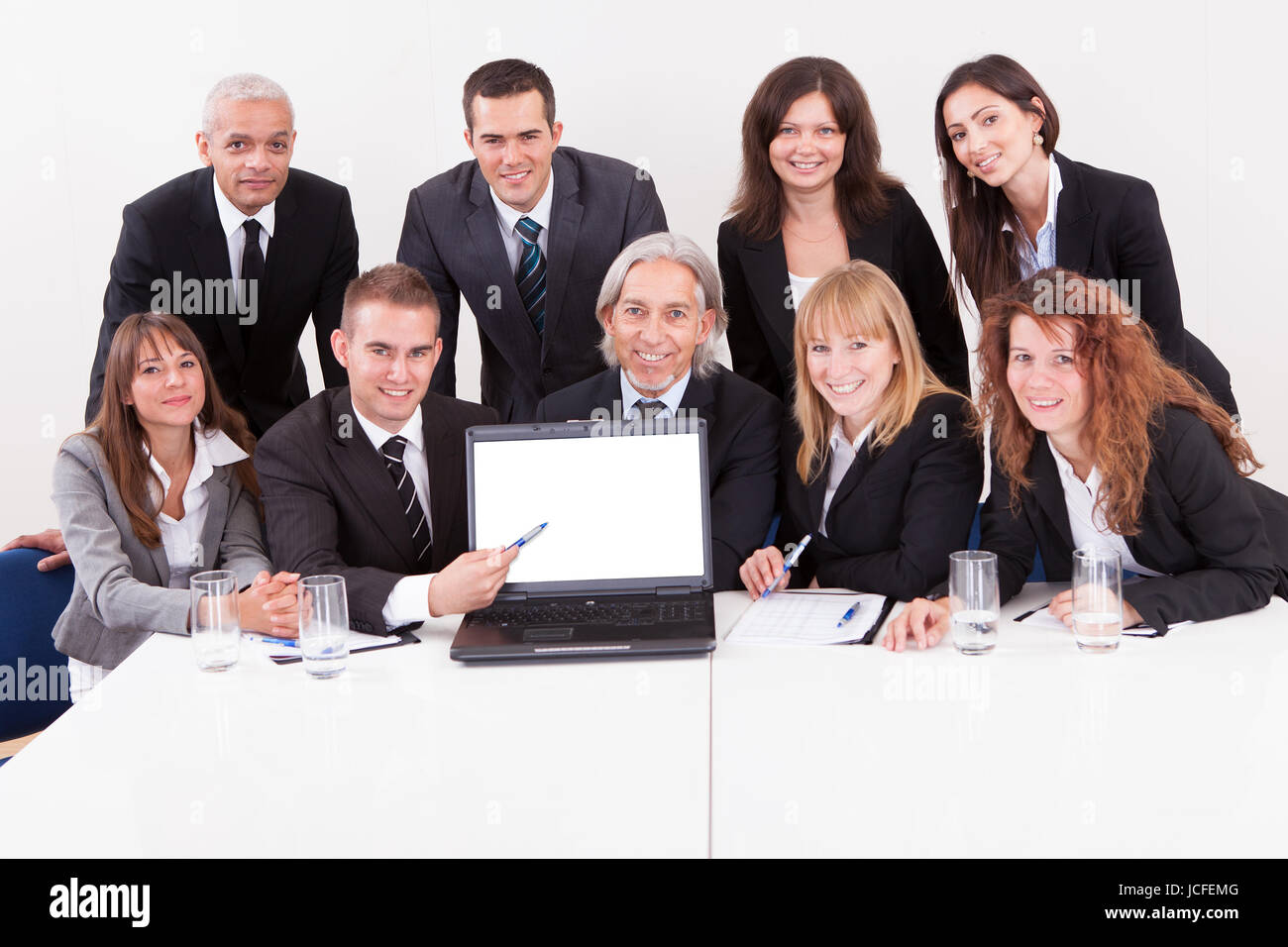 Businessman Showing On Laptop In Meeting With His Colleagues Stock ...