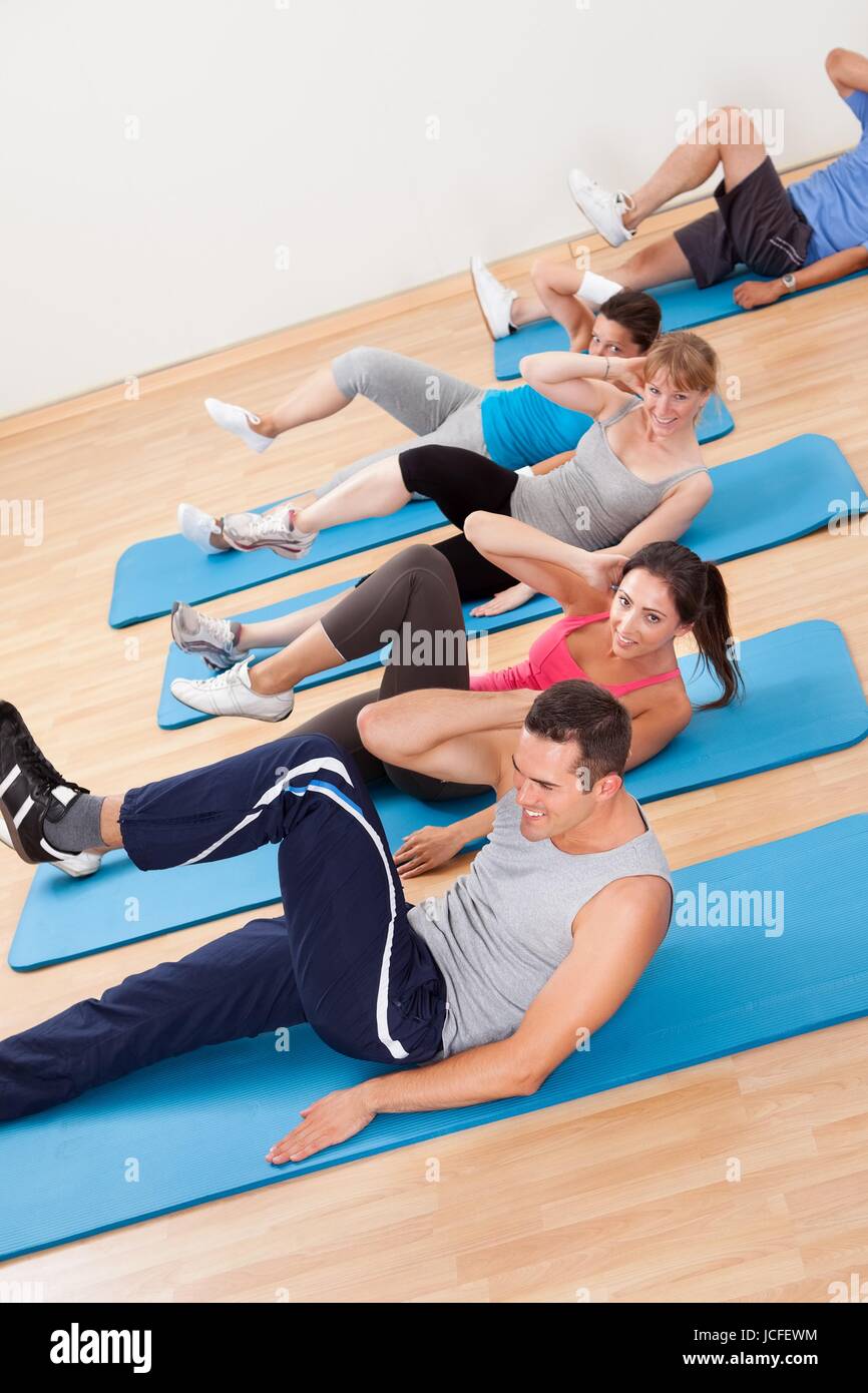 Group women twisting stretching hi-res stock photography and images - Alamy