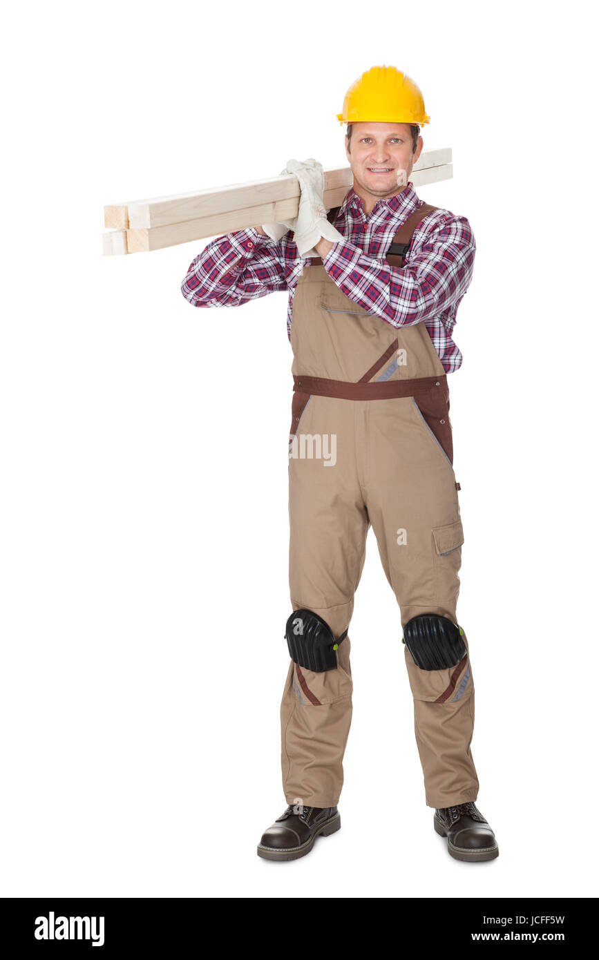Carpenter with wooden planks. Isolated on white background Stock Photo ...