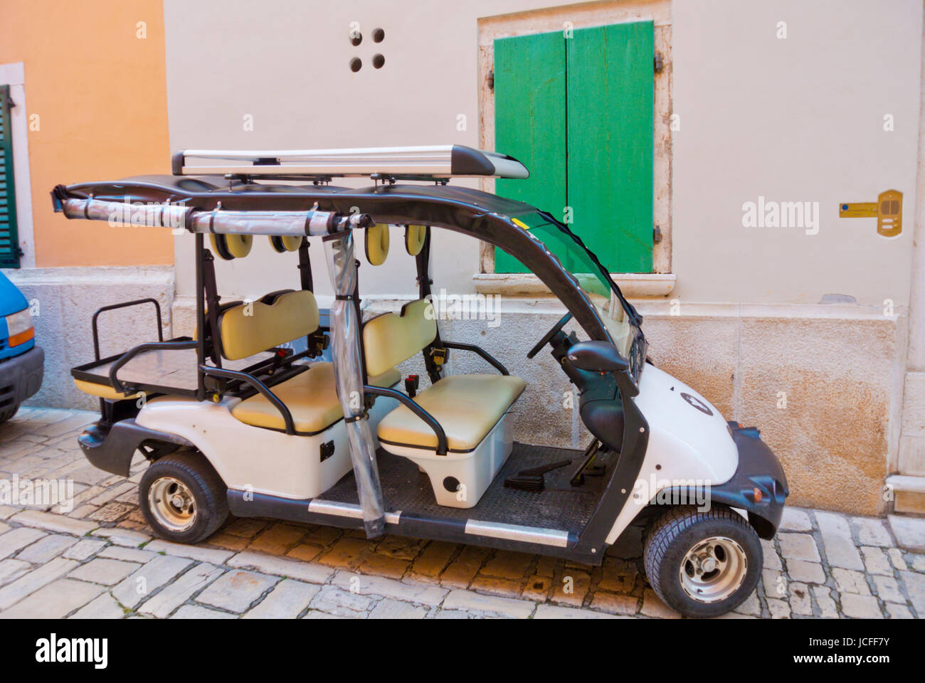 Typical electric mobile cart used by hotels for transporting guests ...