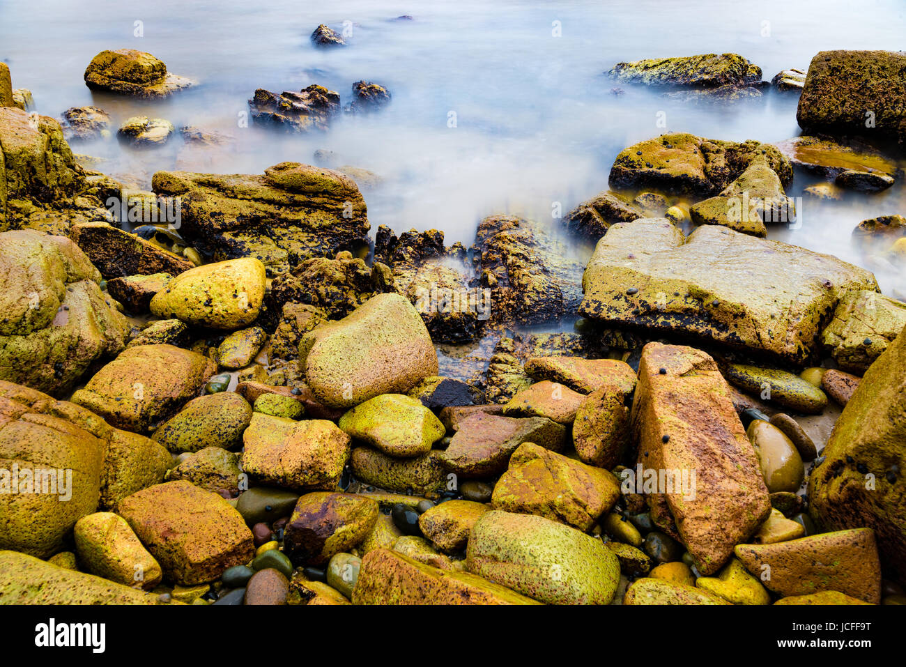 Colourful rocks and water at Diamond Head coast, Australia Stock Photo ...
