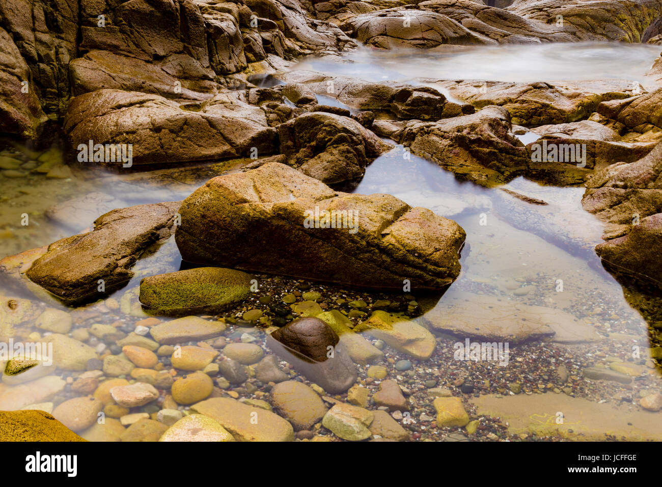 Colourful rocks and water at Diamond Head coast, Australia Stock Photo ...