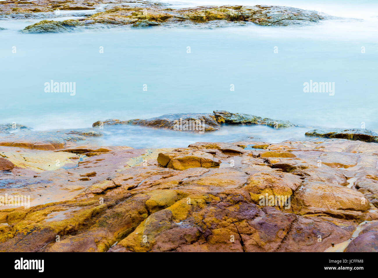 Colourful rocks and water at Diamond Head coast, Australia Stock Photo ...