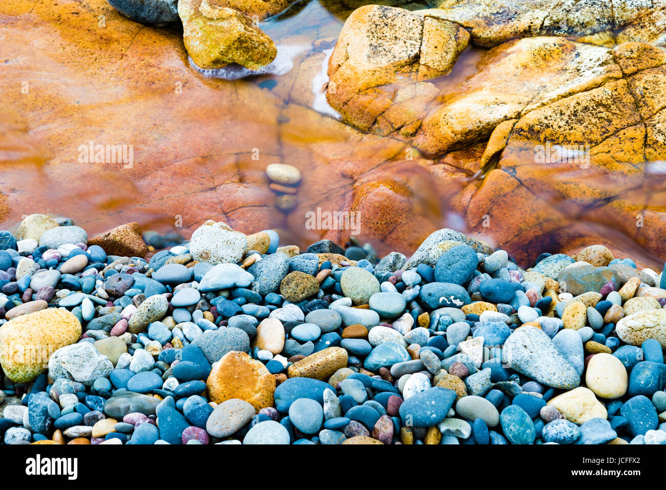 Colourful rocks and water at Diamond Head coast, Australia Stock Photo ...