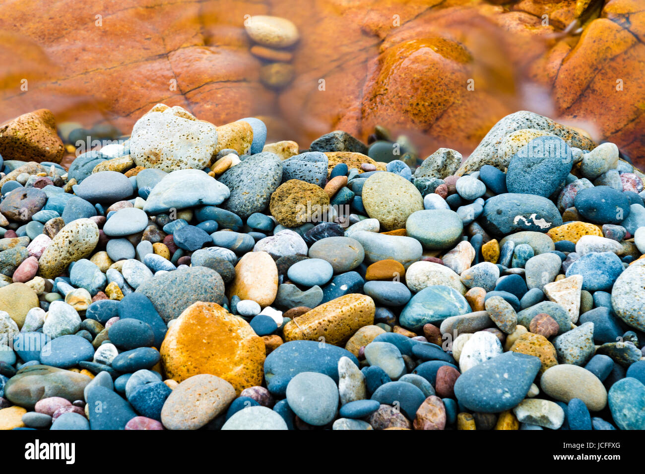 Colourful rocks and water at Diamond Head coast, Australia Stock Photo ...