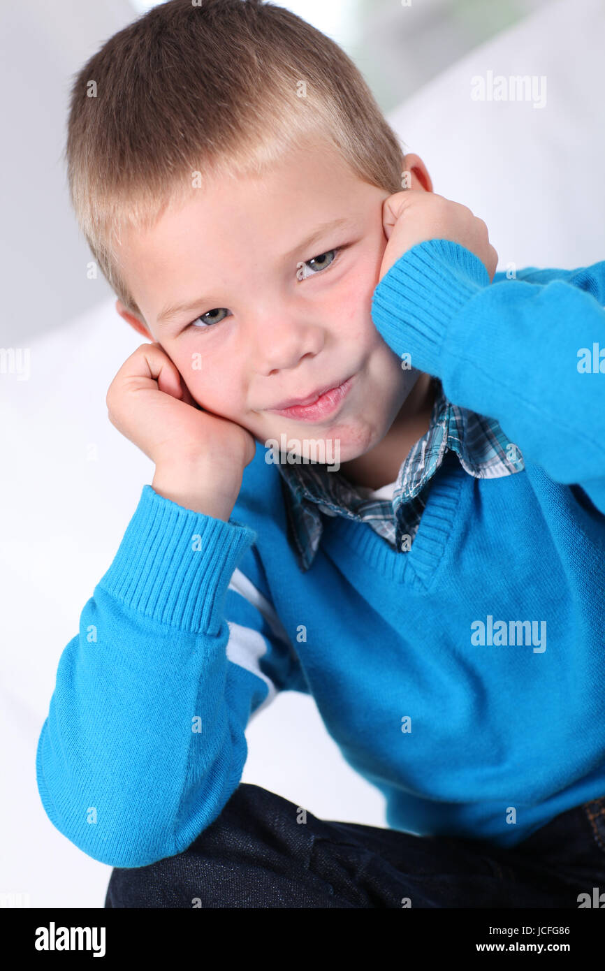 Portrait of shy little boy Stock Photo - Alamy