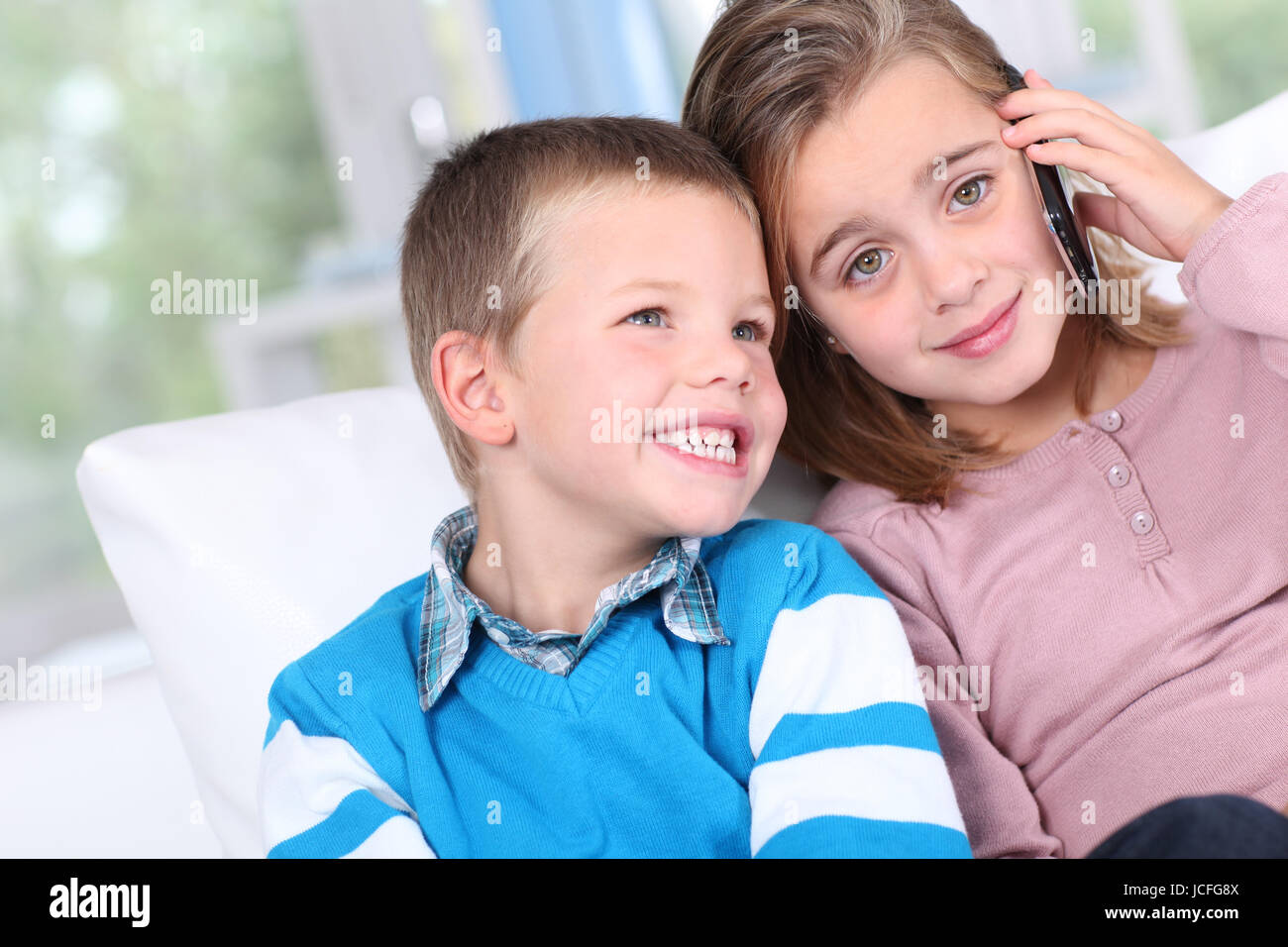 Portrait of kids talking on mobile phone Stock Photo - Alamy