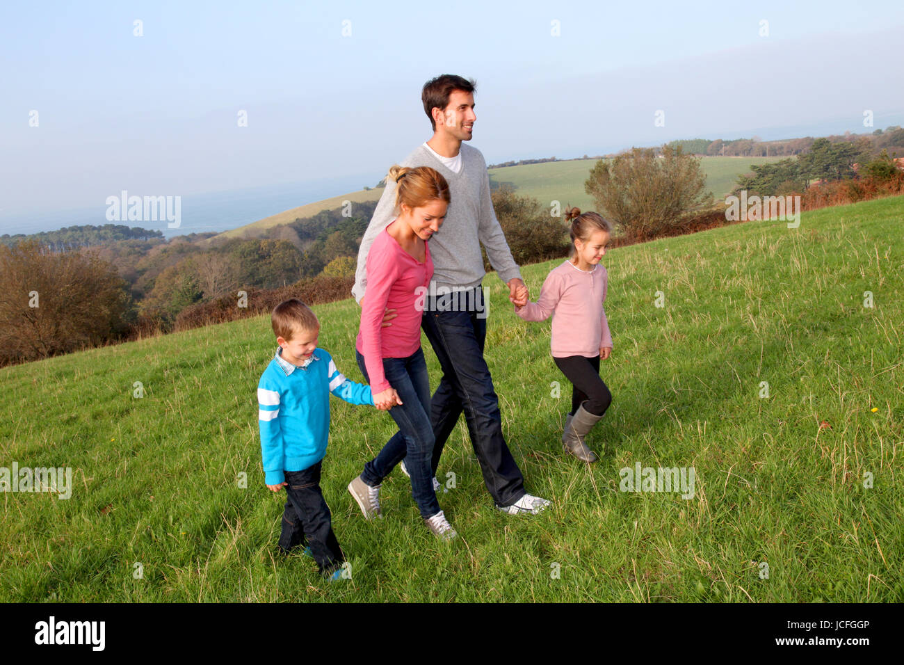 Family having a walk in countryside Stock Photo - Alamy