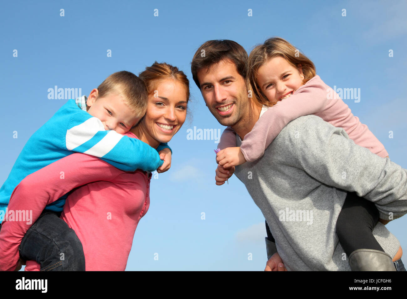 Family of 4 people in countryside Stock Photo - Alamy